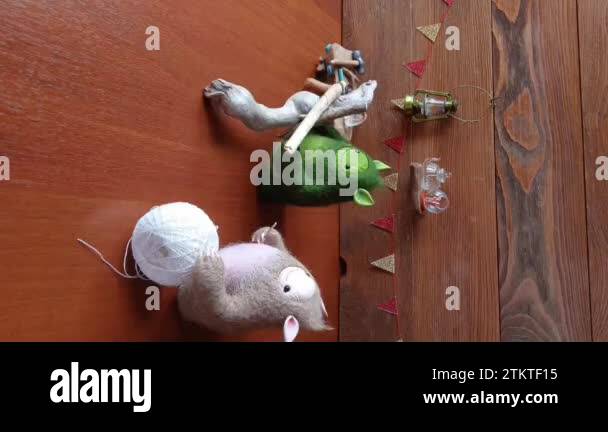 Happy family of woolen toys preparing for parenting. Human hand with ...