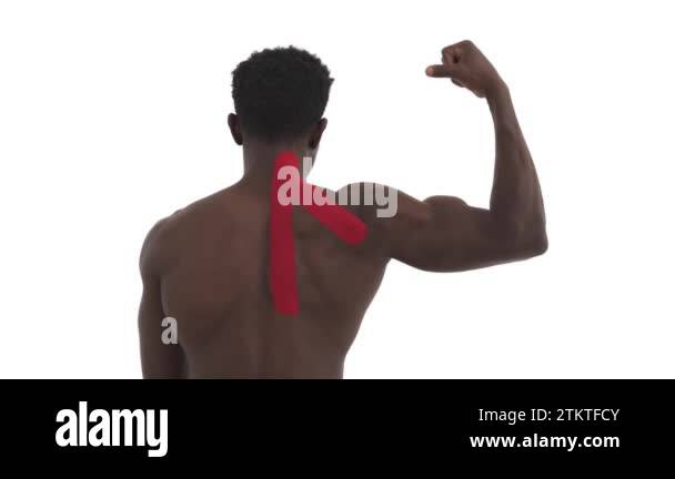Back view of unrecognizable African sportsman lifting hand up ...