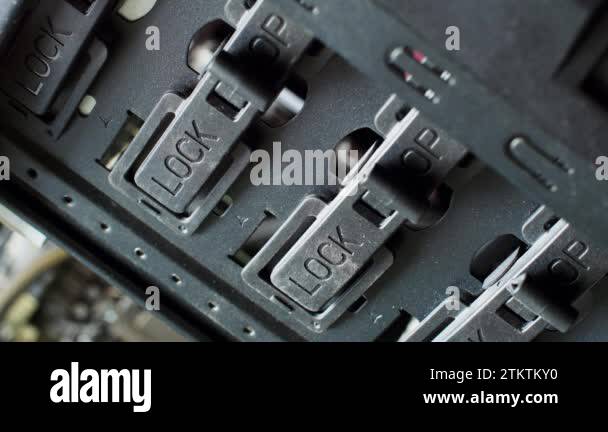 The master closes the lock. A hand in a blue glove closes the locks of ...