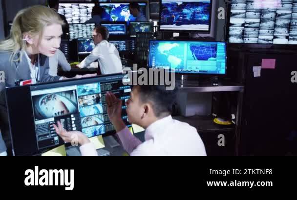 surveillance team working in control room Stock Video Footage - Alamy
