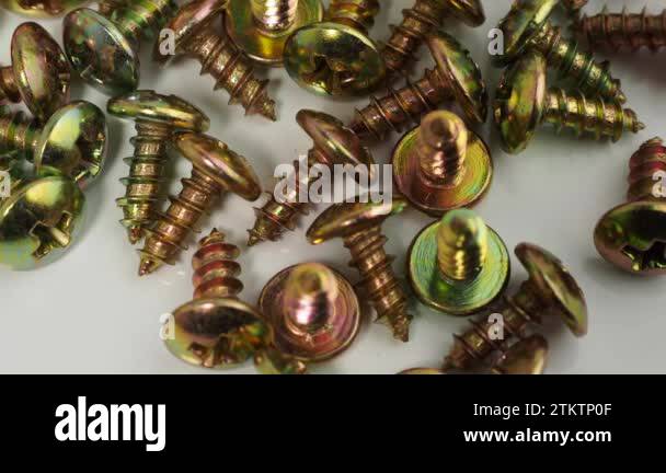 Metal screws on a white background. Rotating screws for driving into ...