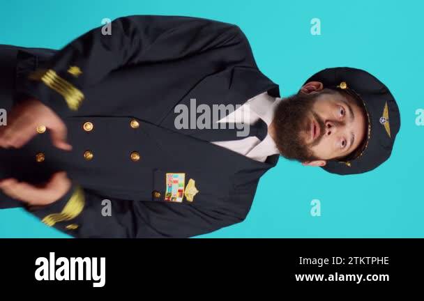 Vertical video: Spiritual aircrew captain praying to god in studio ...