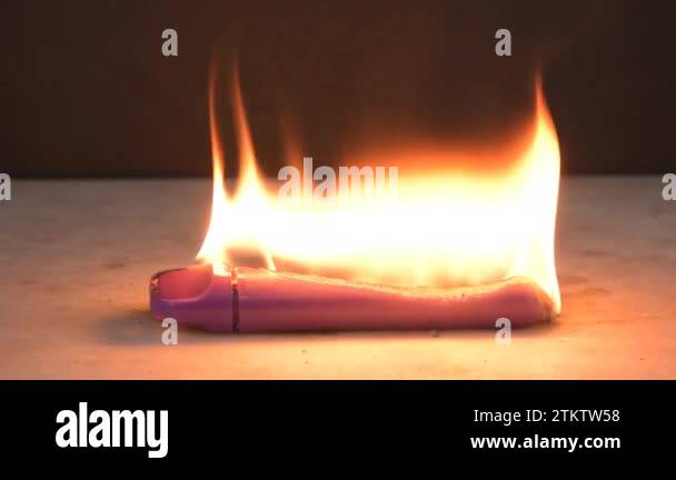The electronic cigarette burns with a bright flame and sparks fly on a ...