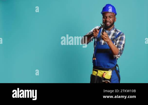 Professional contractor tightening with wrench, using spanner tool to ...