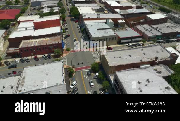 Main street intersection with slow traffic and old historical ...