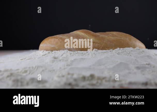 Baking. Baked bread. Bread on flour, a lot of white flour. Loaf with a ...