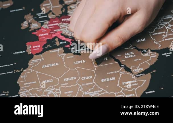 Scratching Egypt Country on the Surface of Scratch World Map. Woman ...