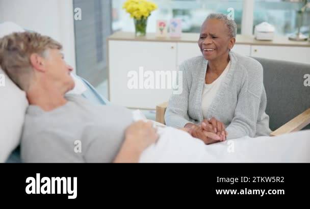 Senior women friends, hospital bed and holding hands with conversation ...