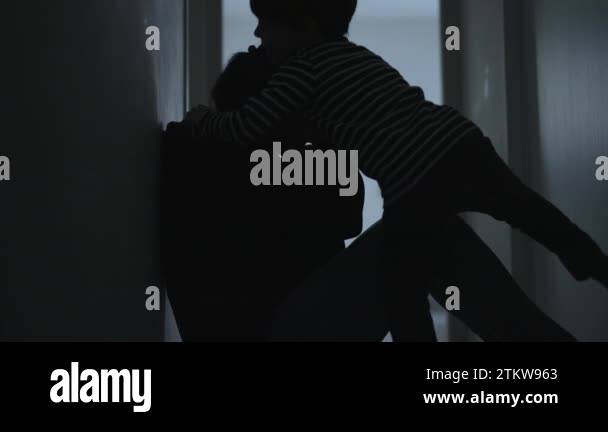 Small child hugging depressed mother during crisis. Little boy ...