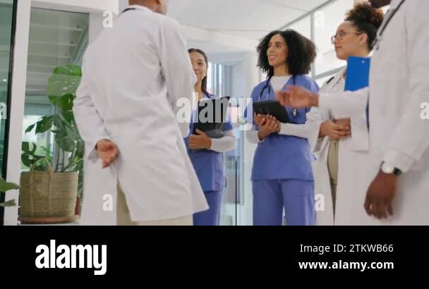 Doctors, handshake and welcome with group, hospital and leader for kindness, respect or ...