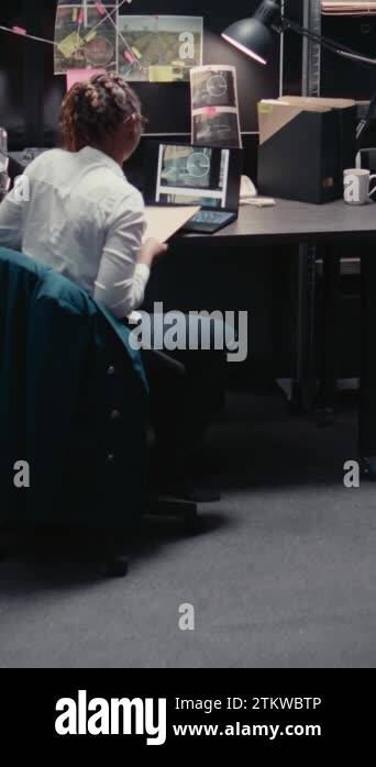 Vertical video: Team of inspectors analyzing case reports for details ...