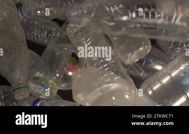 Plastic bottles being dumped. A concept about reducing and recycling ...