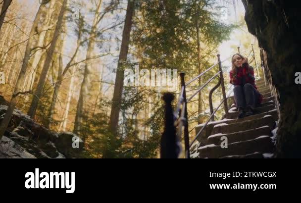 Female traveler finds inner peace in the beauty of nature, hiking through mountain ranges, and ...