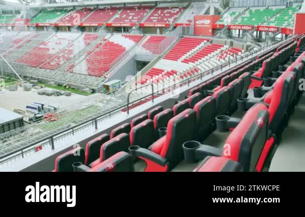 Large sports stadium with red and black seats for viewers. Modern ...
