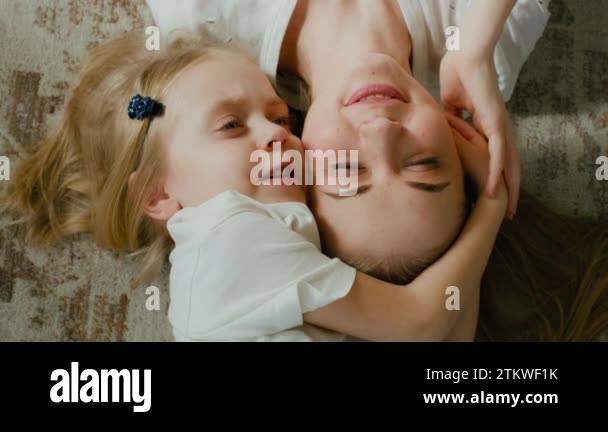 Cute affectionate adopted little kid preschool girl hugging cuddling ...