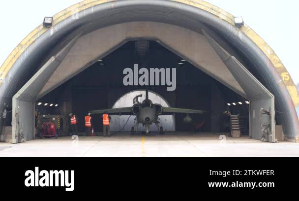Jet fighter aircraft inside the shelter hangar. Front view as the ...