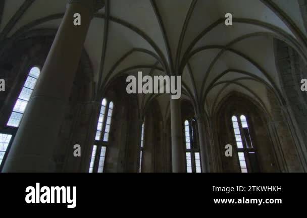 The camera moves inside the church, which is located on top of the Mont ...