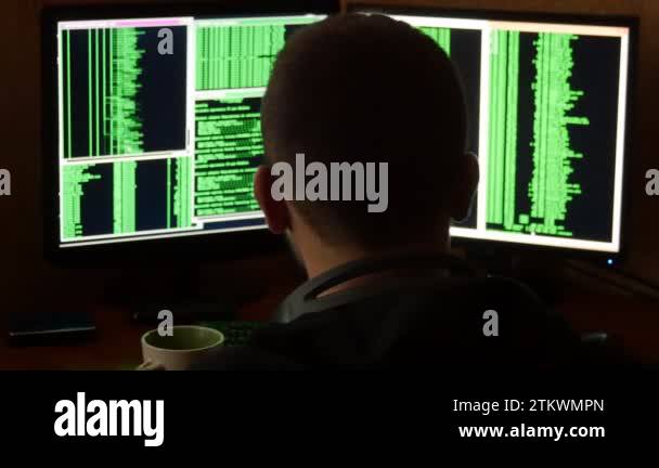 Hacker breaking code and drinking from the cup at your desk. Criminal ...