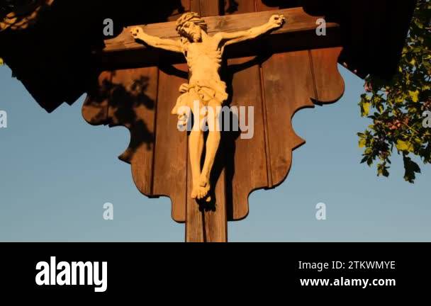 Jesus Christ on the cross in blooming chestnut trees.Easter spring ...