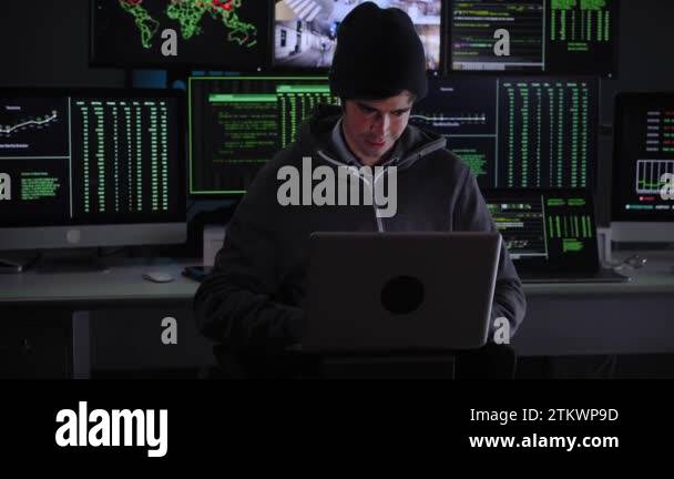 Hacker Accessing A Company Confidential Database From His Subway Hideout Young Computer