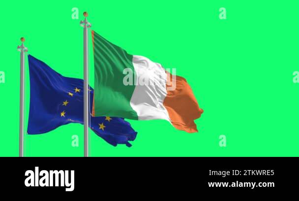 Ireland and the EU flags fluttering isolated on a green background ...