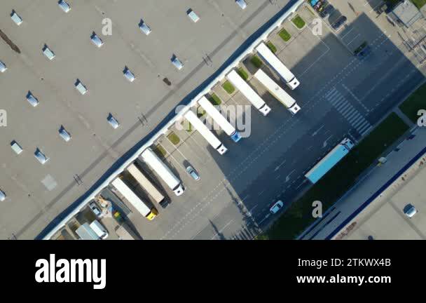 Logistics park with warehouse. Semi-trailers trucks standing on car ...