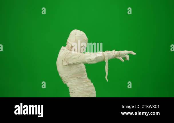Green screen isolated chroma key side view video capturing a mummy ...