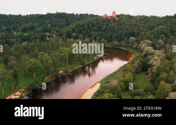 River Gauja in the Latvian nature park. Turaida Castle on the banks of ...