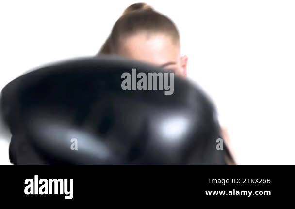 Woman boxer kicking air. Female fighter training punch on white ...