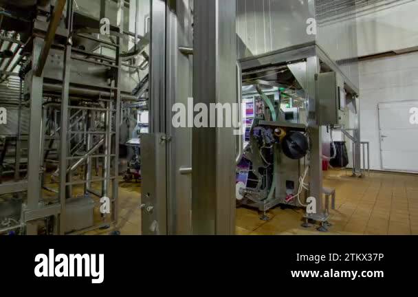 Staff members regulate operation of production equipment at massive ...