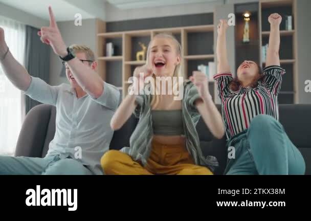 Cheerful happy Caucasian family cheering for favorite team and it ...