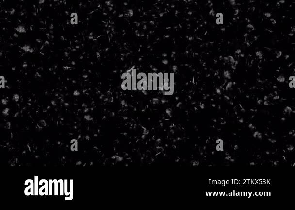 White ash or dust particles, flying and floating on air in a loop ...