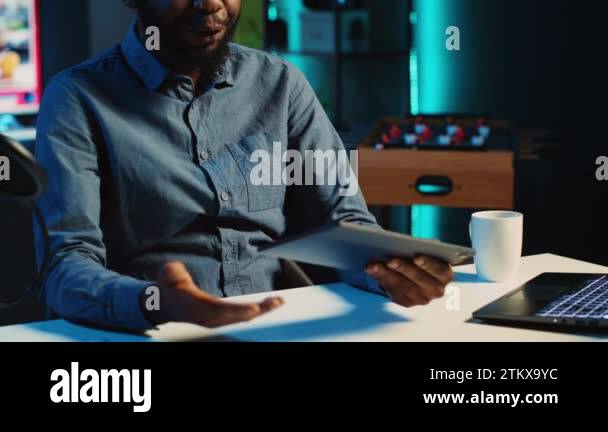 African american content creator filming technology review of newly ...