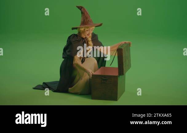 Green Screen. A Magical Girl in a Medieval Dress Opens a Magic Chest ...