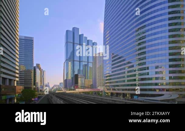 BTS Skytrain, light metro electric train, running fast in downtown ...