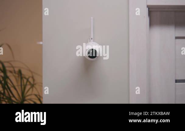 Zoom out of installed security camera on the wall in the modern ...