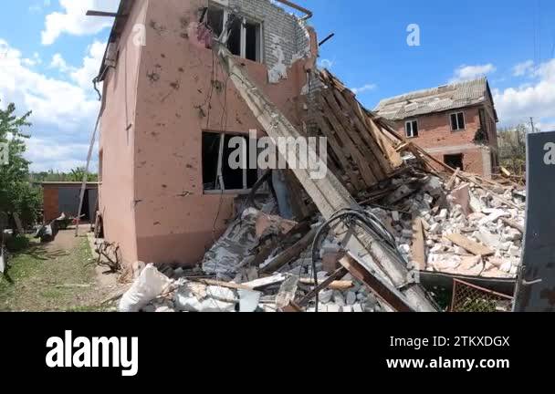 A private house destroyed by artillery shelling. No roofs, no windows ...