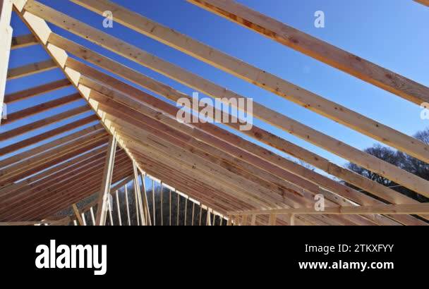 New house under construction is being built with roof truss system in ...