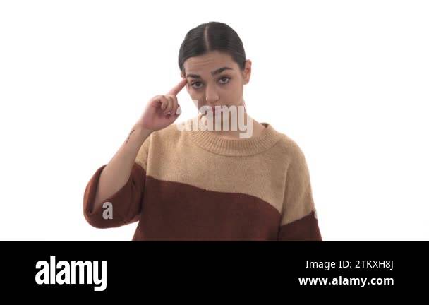 Beautiful woman expressing negative emotions by placing index finger to ... Beautiful woman expressing negative emotions by placing index finger to ...