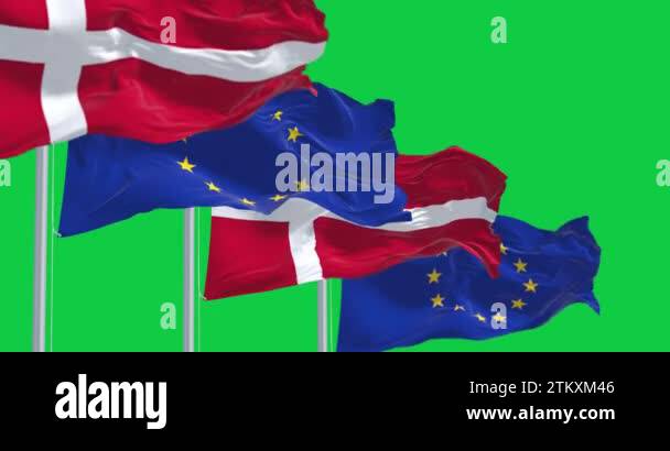 National flags of Denmark and of the European Union waving on a green ...