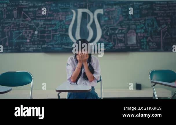 a female student cries in class after being bullied by her friends ...
