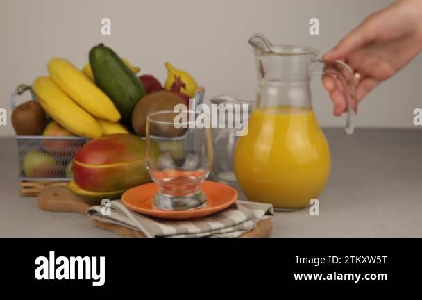 Yellow refreshing summer drinks. Fresh Mango juice, orange juice. Fruit ...