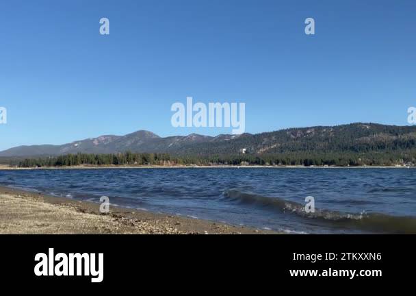 windy lake mountain lakeside shore wind breeze blowing water current ...