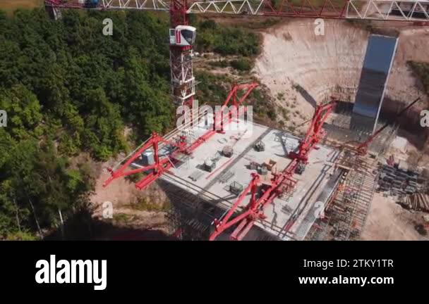 Process of constructing road bridge concrete abutment surrounded by ...