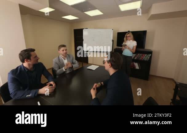 Signing a contract with a team of partners in the meeting room Stock ...