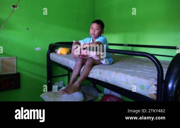 Ubud, Indonesia - October 22, 2022: Side view on lonely boy orphan ...