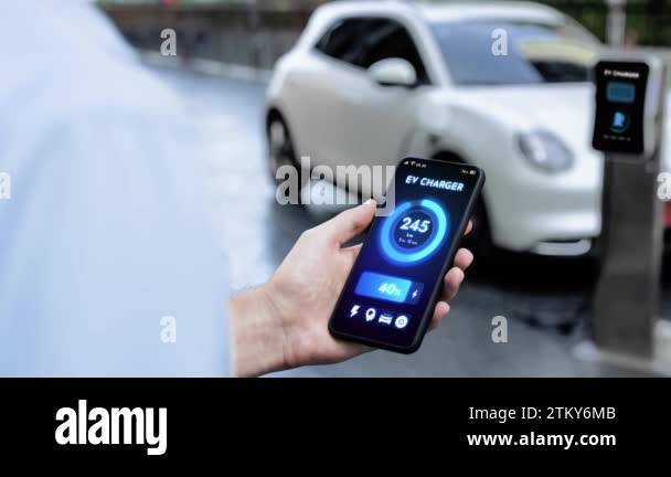 Businessman holding smartphone display battery status interface by ...