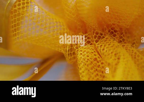 yellow mesh texture with a cheerful bow a delightful fusion of textures ...
