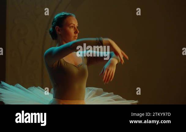 Cinematic shot of beautiful female ballet dancer on choreography ...