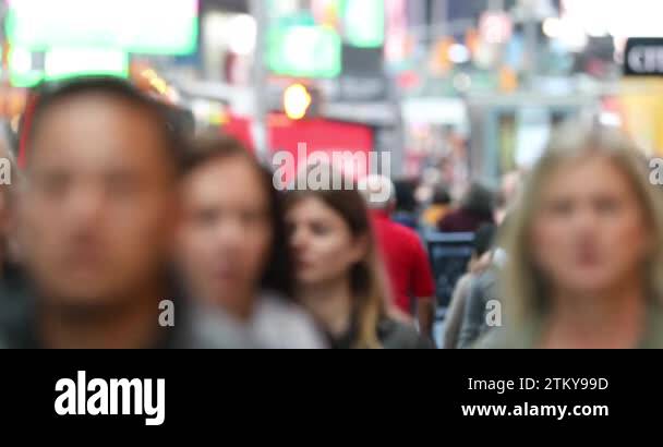 Anonymous Urban Crowd of commuters, unrecognizable tourists walking in ...